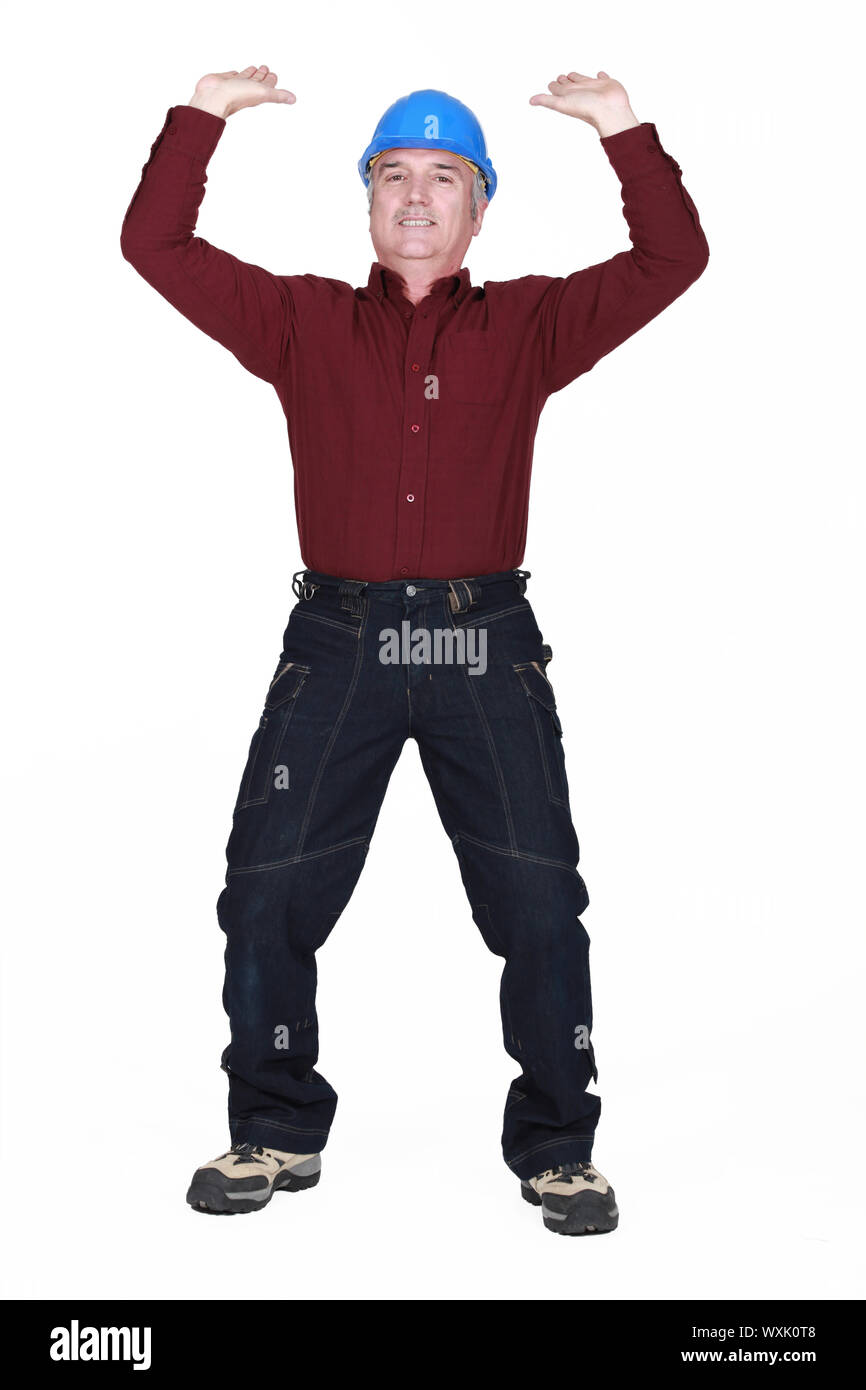 Senior architect pretending to push upwards Stock Photo - Alamy