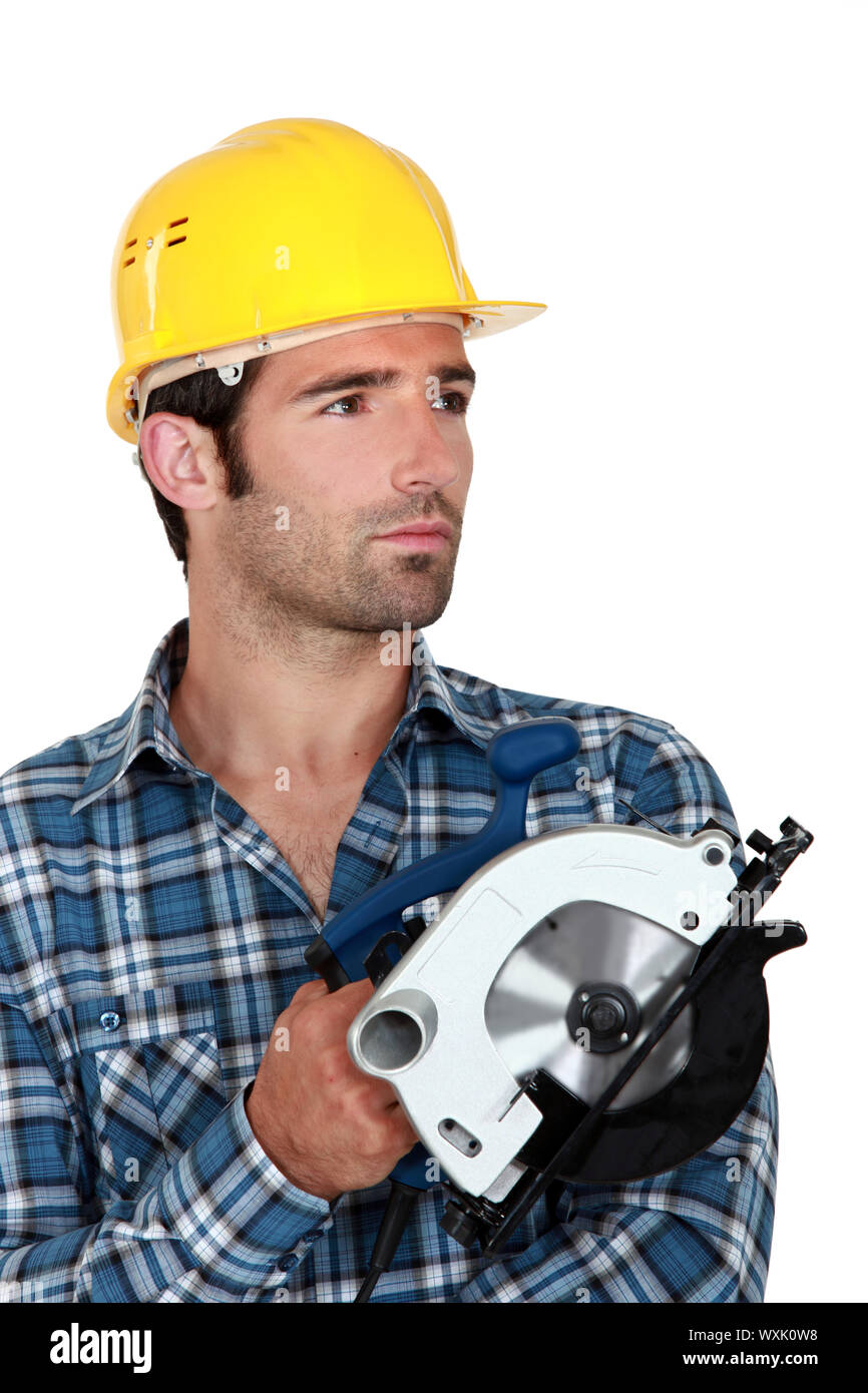 Man holding circular saw Stock Photo - Alamy