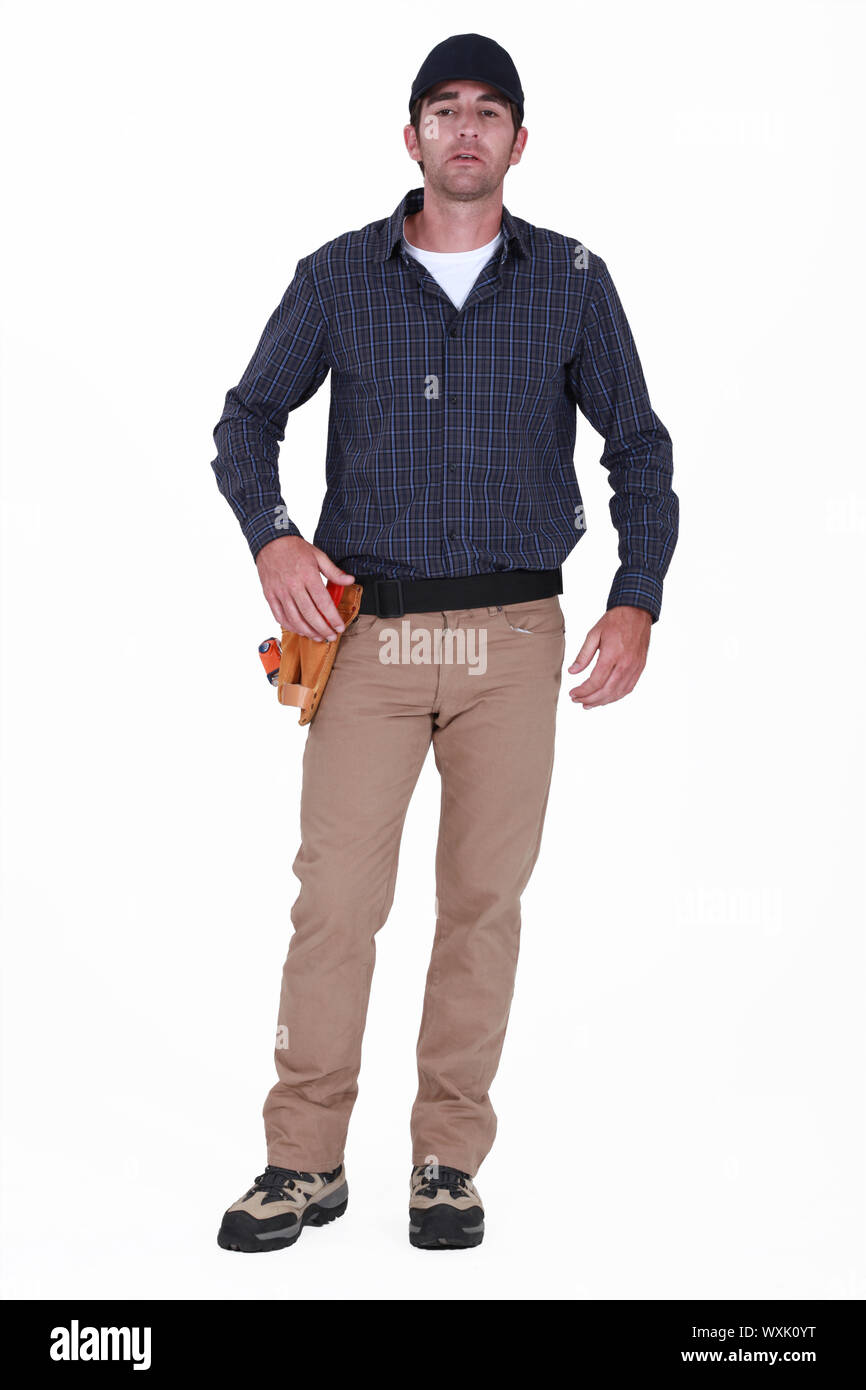 Casual handyman wearing cap Stock Photo - Alamy