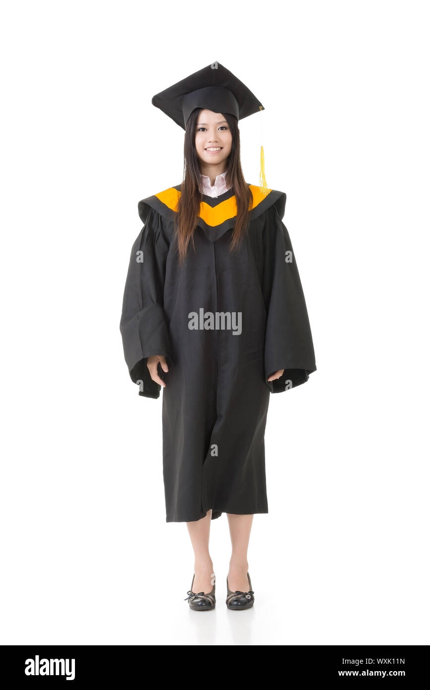 Beautiful smiling young graduation woman standing. Isolated on white ...