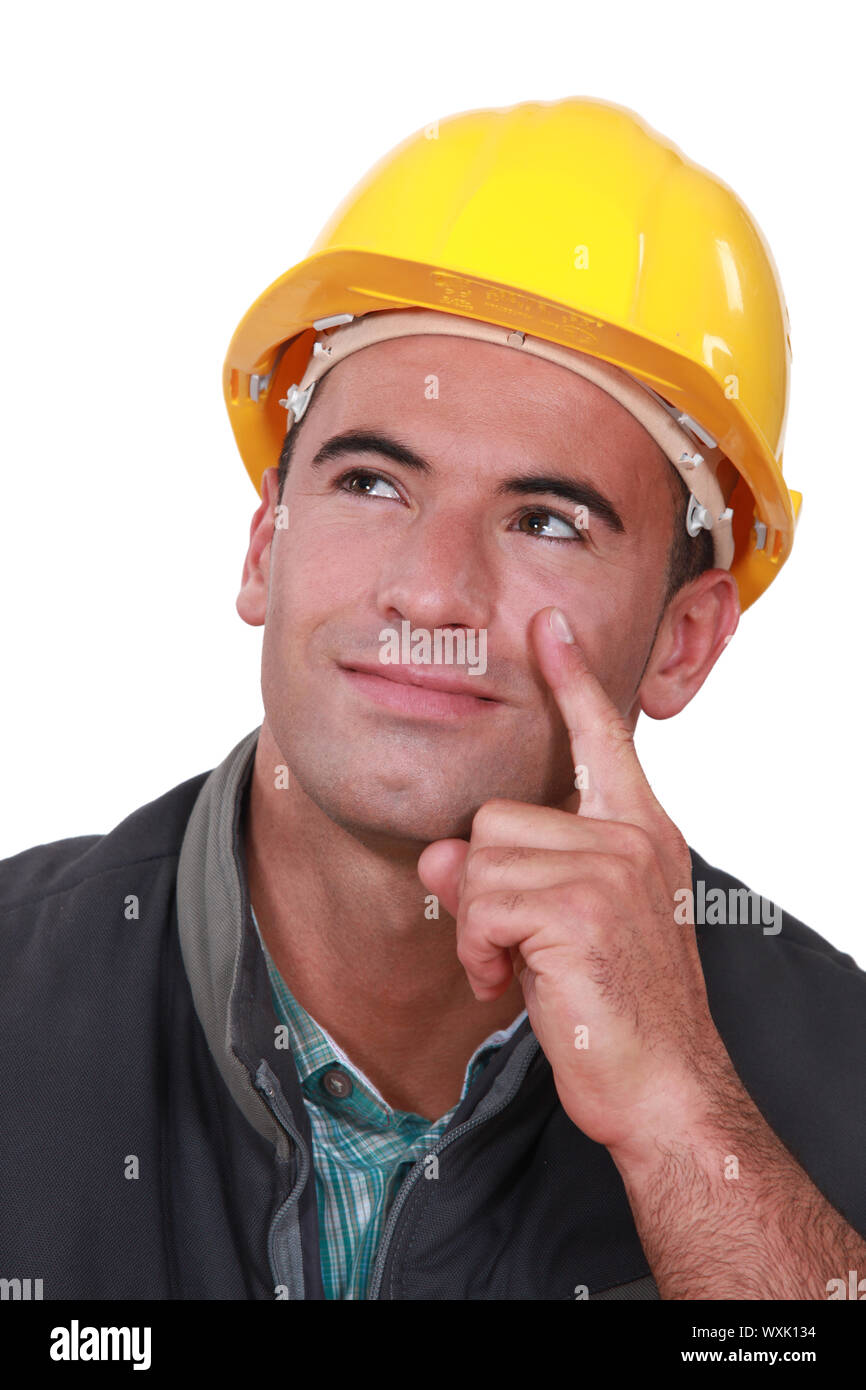 Builder thinking of an idea Stock Photo - Alamy