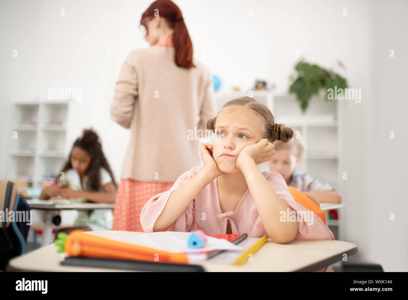 Sad teacher classroom hi-res stock photography and images - Alamy