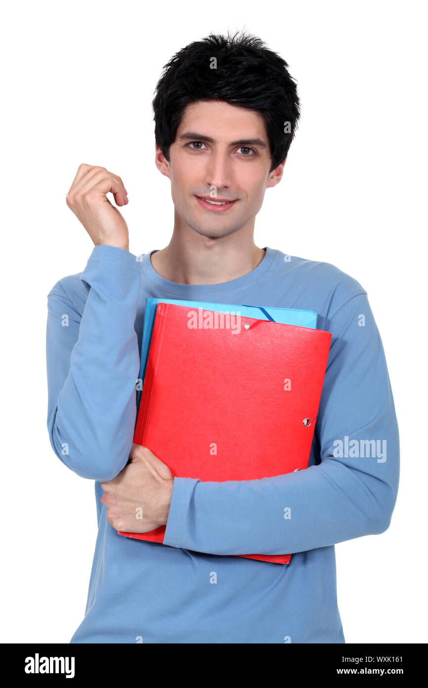 Young man carrying files portrait hi-res stock photography and images ...