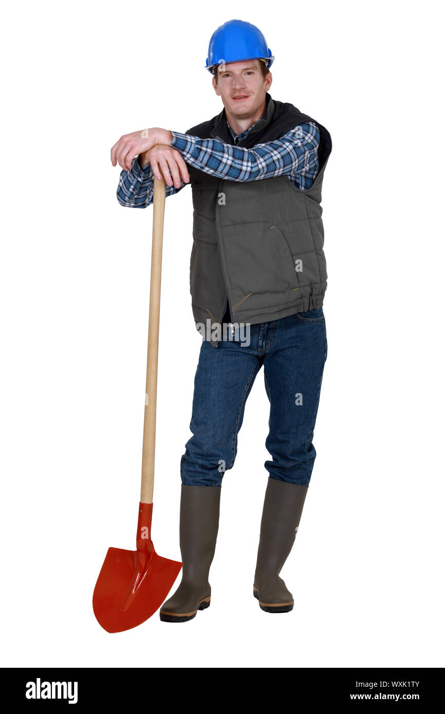 Young construction worker with a shovel Stock Photo - Alamy