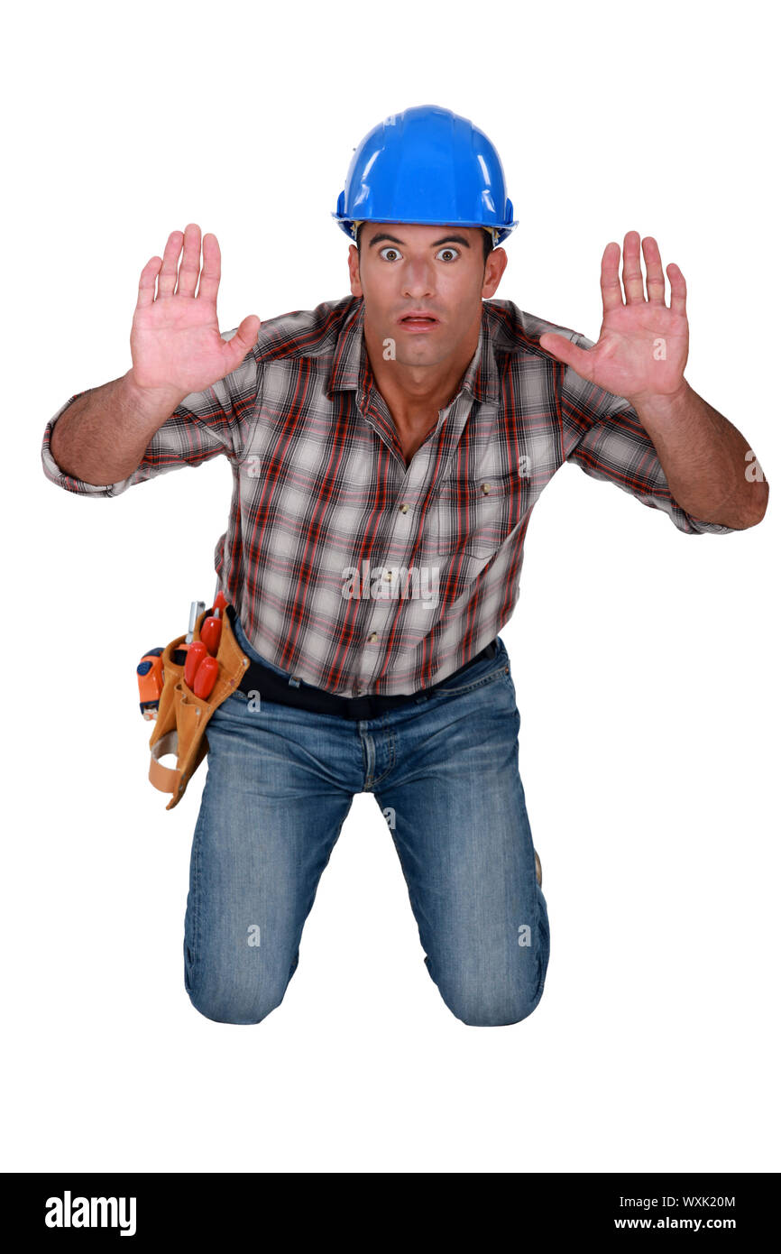 Builder in a state of shock Stock Photo - Alamy