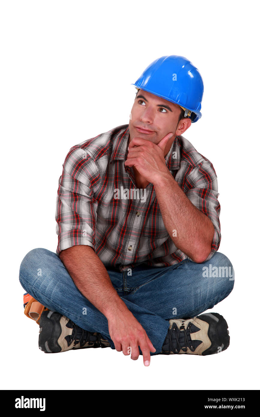 A pensive construction worker Stock Photo - Alamy