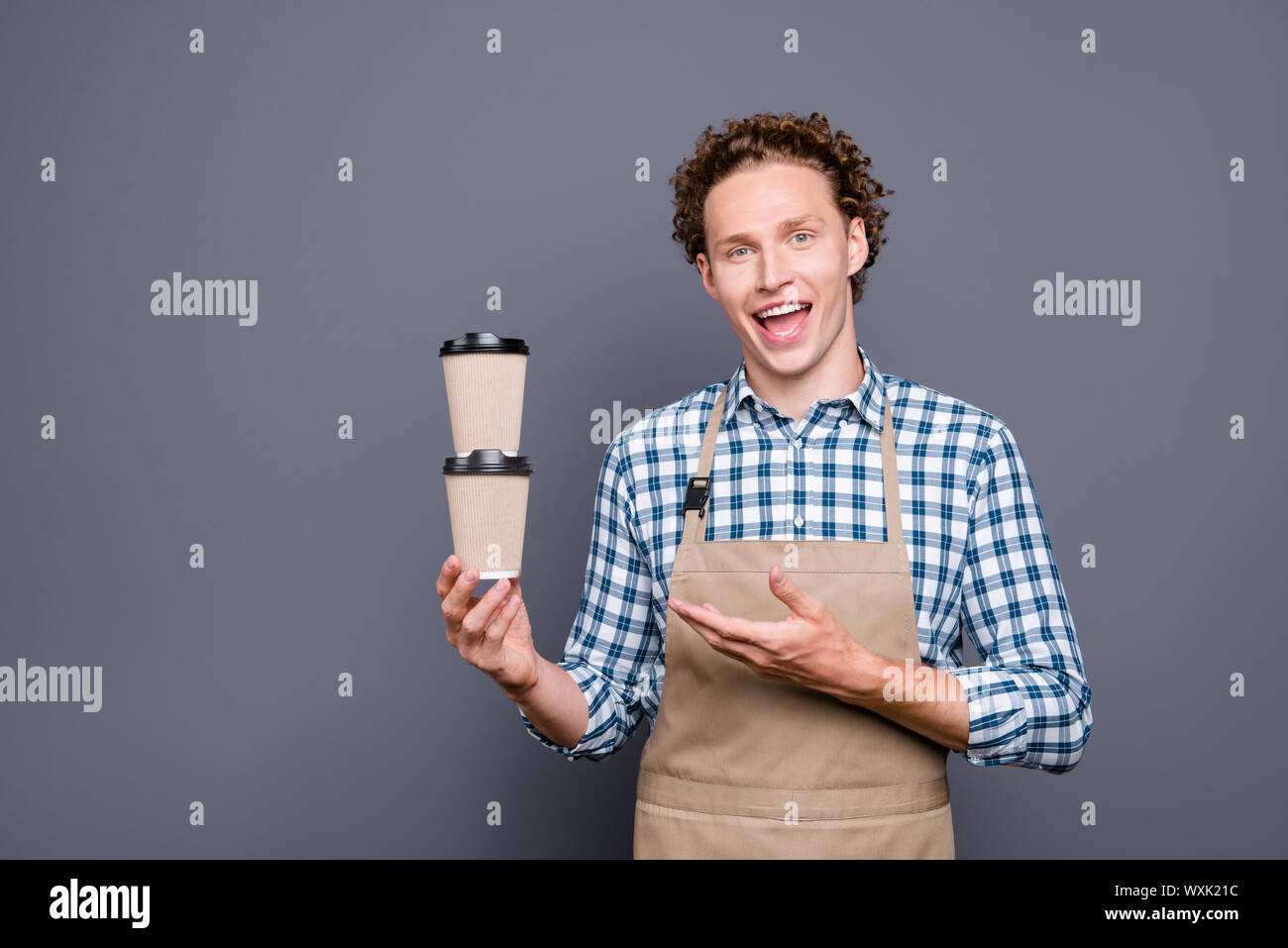Stylish nice attractive cheerful guy with wavy hair in casual ch Stock ...