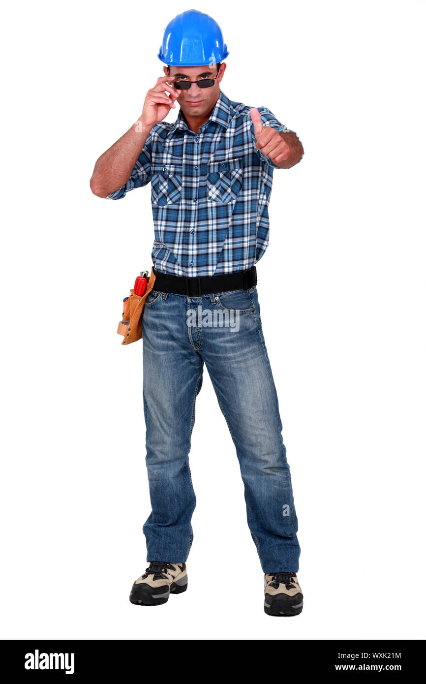 Confident construction worker on white background Stock Photo - Alamy