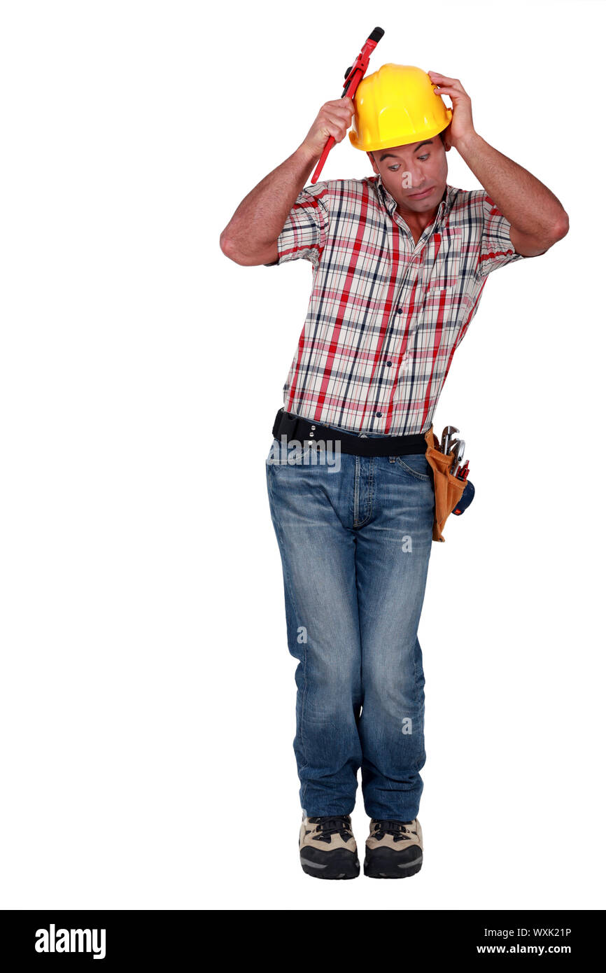 A scared construction worker Stock Photo - Alamy