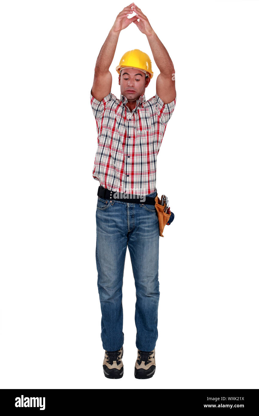 Tradesman raising his arms over his head Stock Photo - Alamy