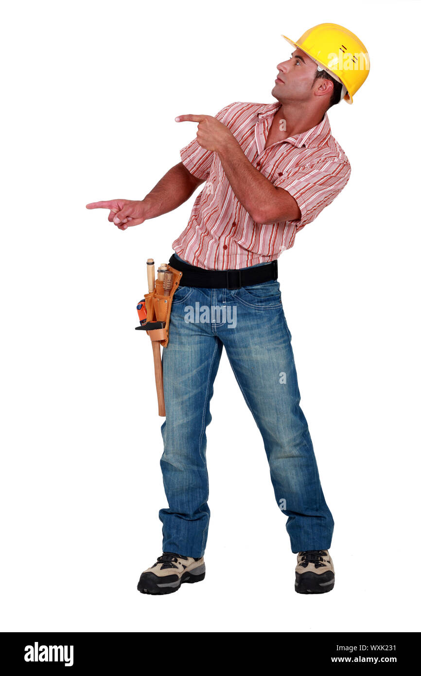 Workman pointing something on white background Stock Photo - Alamy