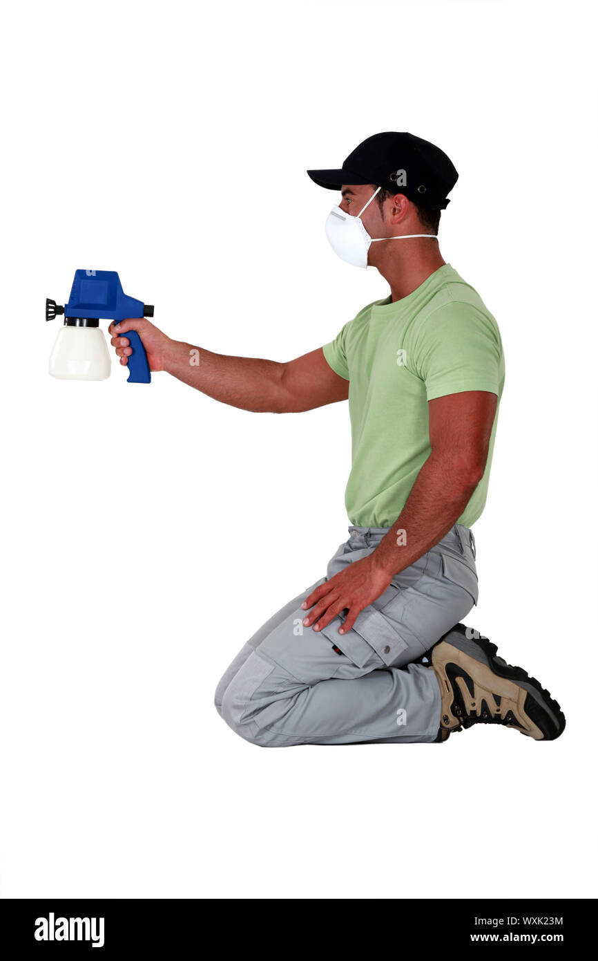 A painter using a spray gun Stock Photo - Alamy