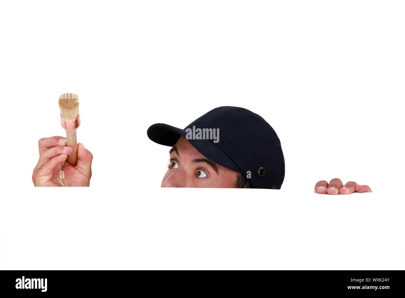 Hiding behind wall Cut Out Stock Images & Pictures - Alamy