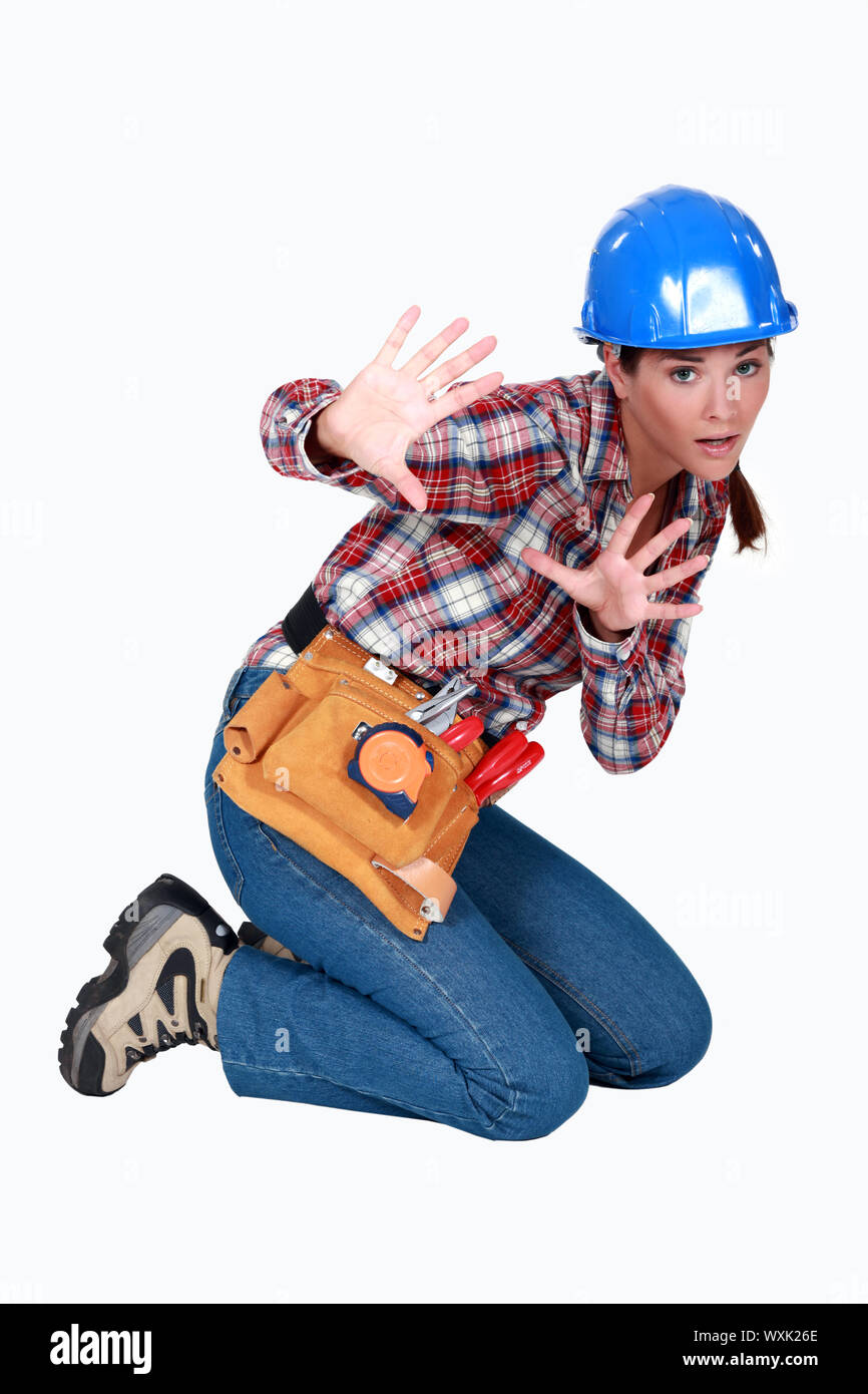 A scared female construction worker Stock Photo - Alamy