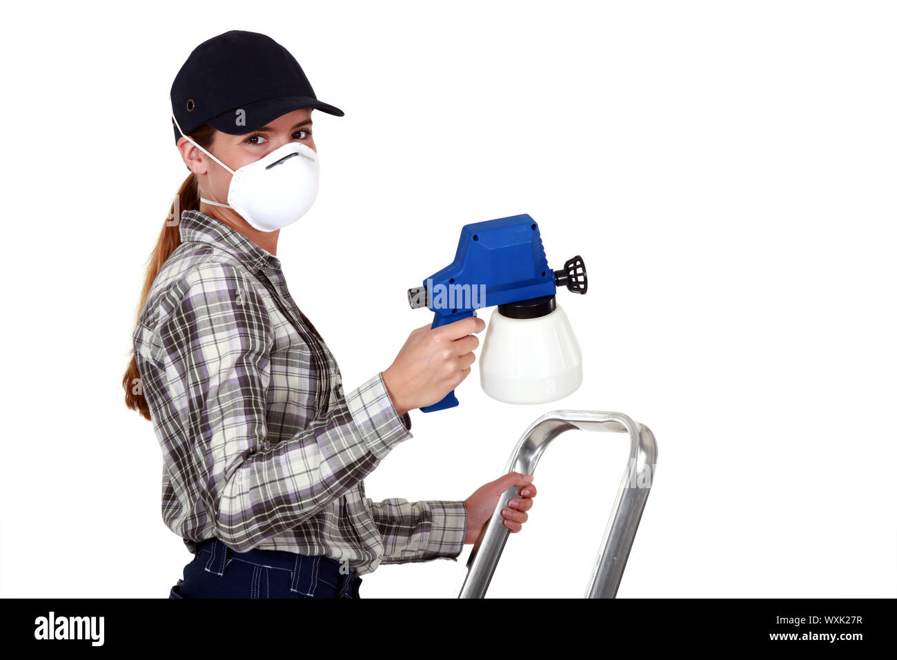 A female painter using a spray gun Stock Photo - Alamy