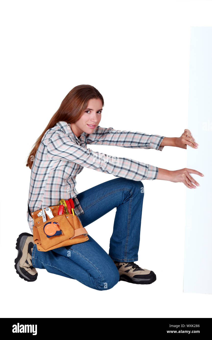 Young woman pulling white sign Stock Photo - Alamy