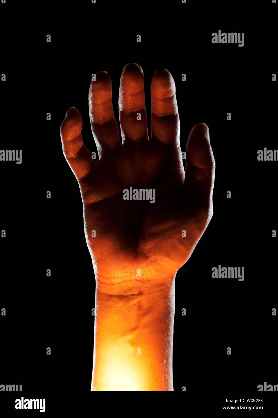A Man's hand lit from below Stock Photo - Alamy