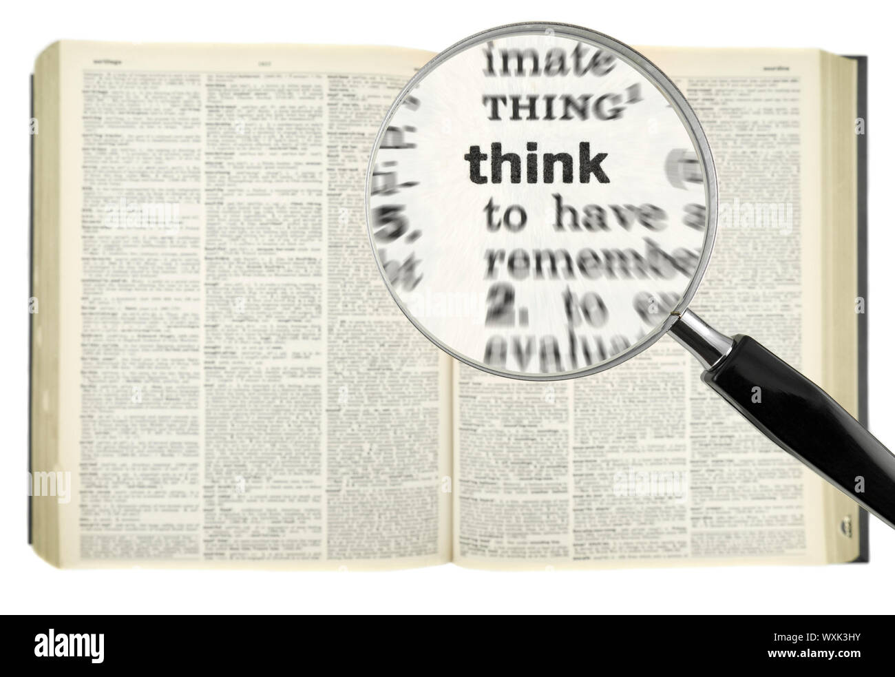 A magnifying glass on the word THINK on a dictionary Stock Photo - Alamy