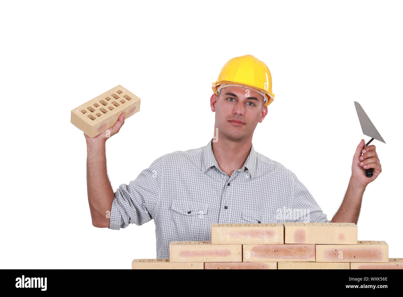 A mason building a wall Stock Photo - Alamy