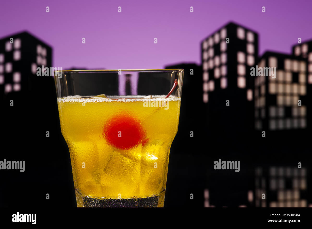 Skrew Driver cocktail in city skyline setting Stock Photo - Alamy