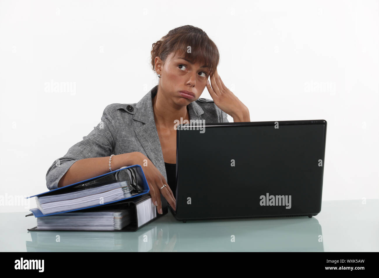 Woman overwhelmed at work Stock Photo - Alamy