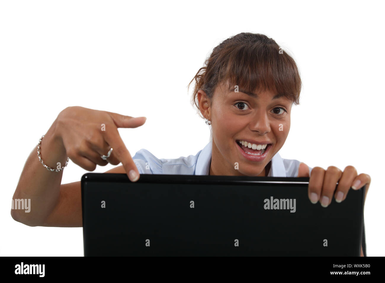 Woman pointing to her laptop Stock Photo - Alamy