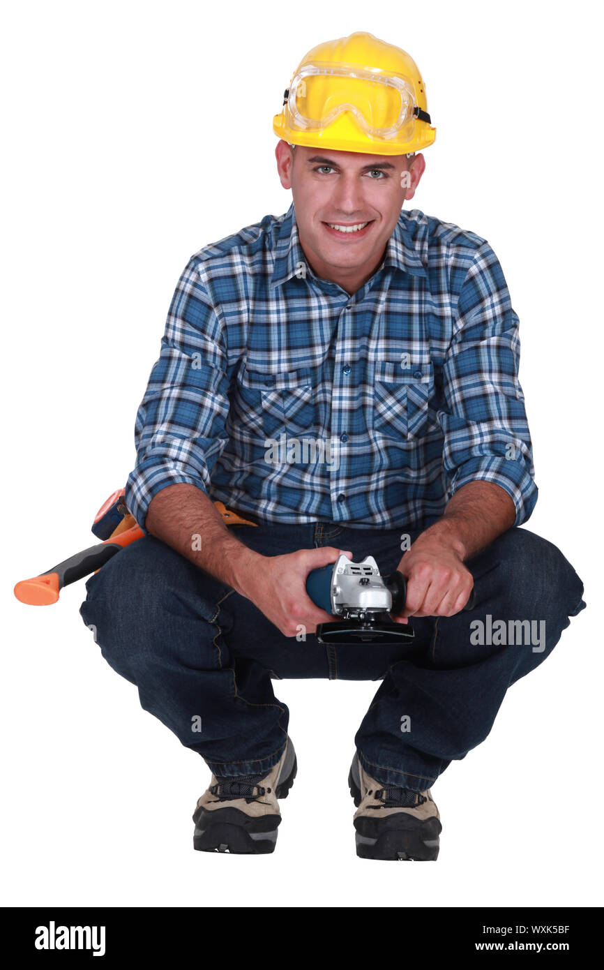 Man holding angle-grinder Stock Photo - Alamy