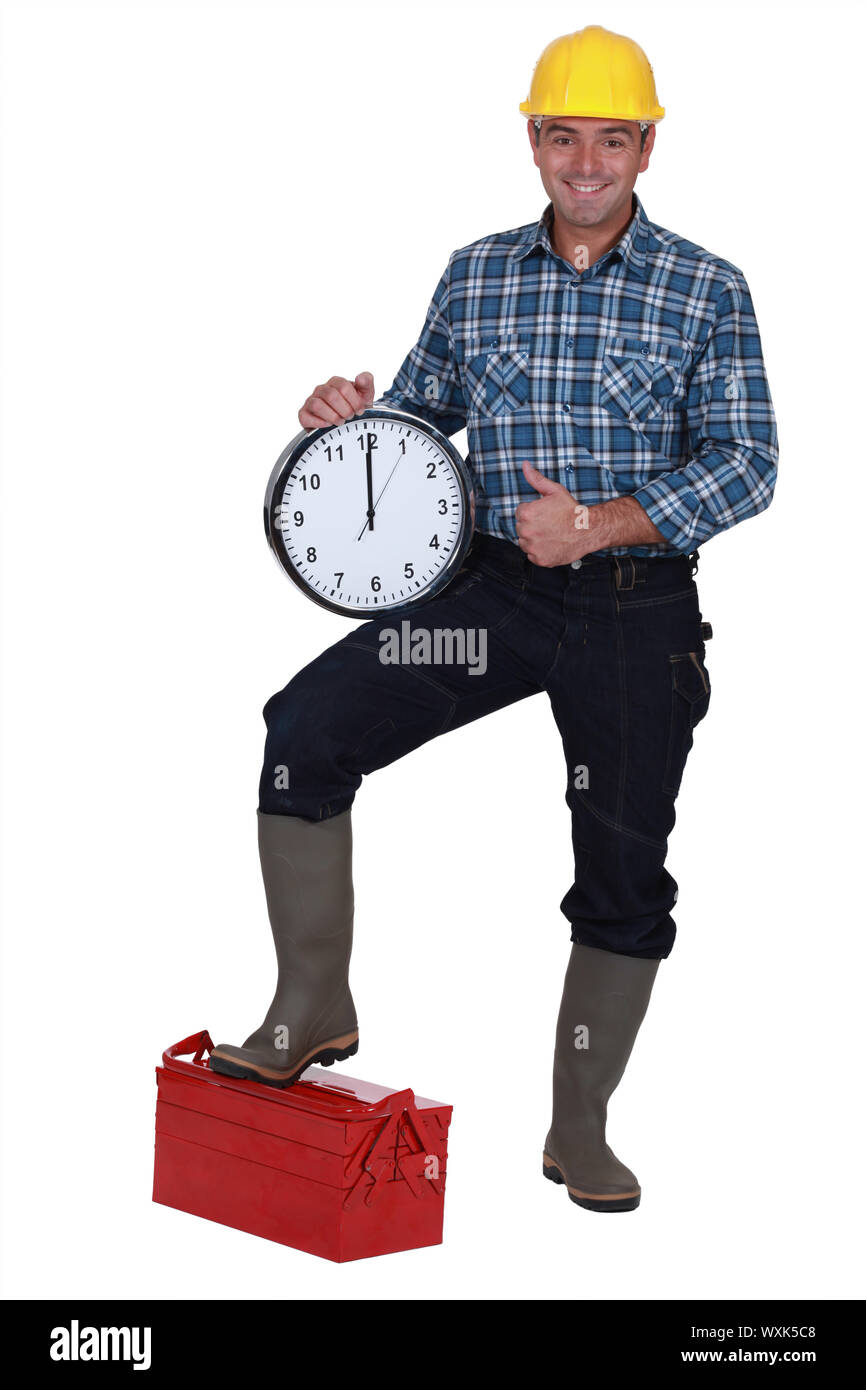 builder holding large block Stock Photo - Alamy