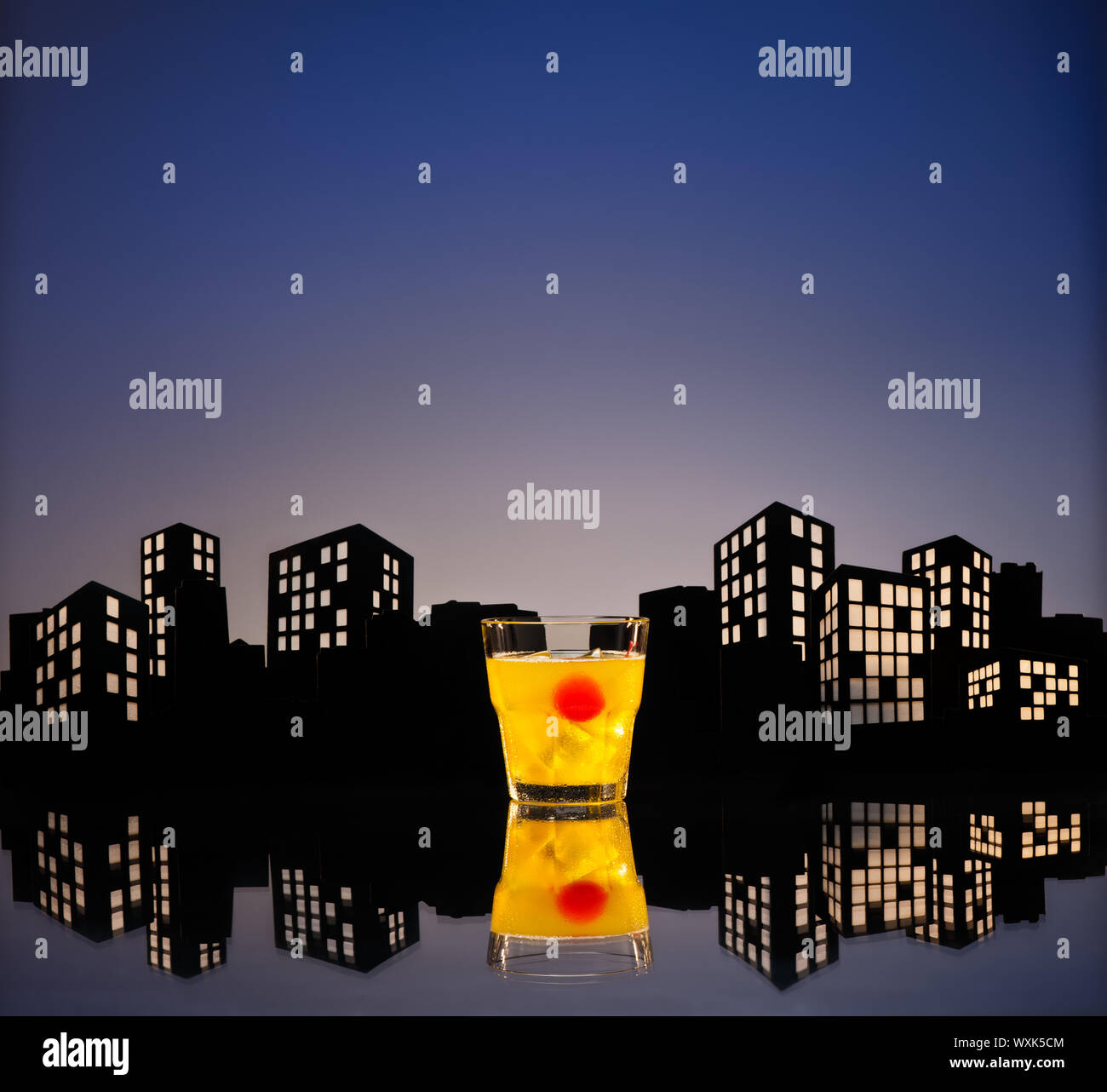 Skrew Driver cocktail in city skyline setting Stock Photo - Alamy