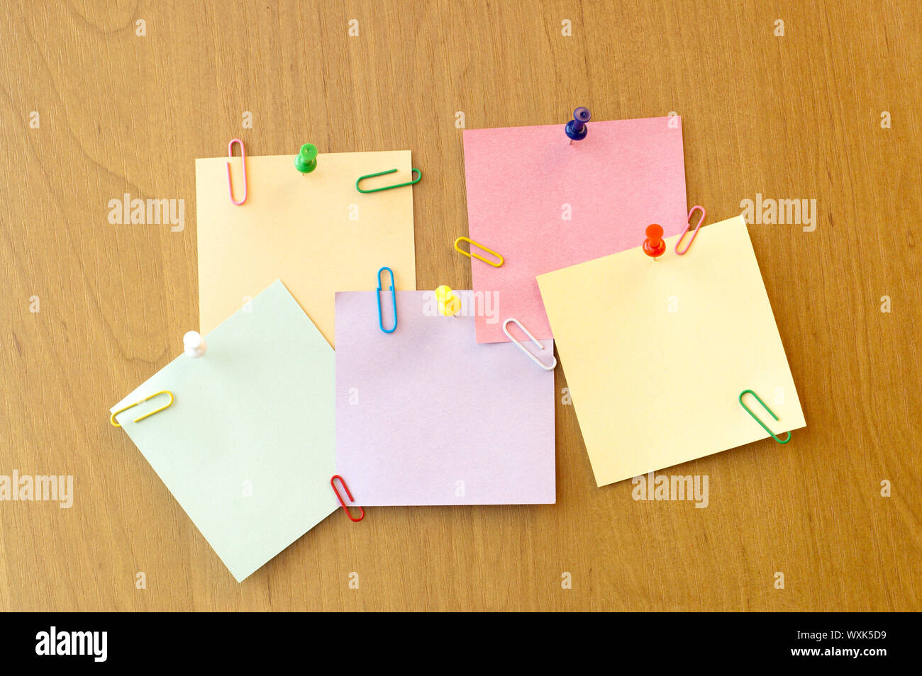 five sticker notes with pins and clips Stock Photo - Alamy