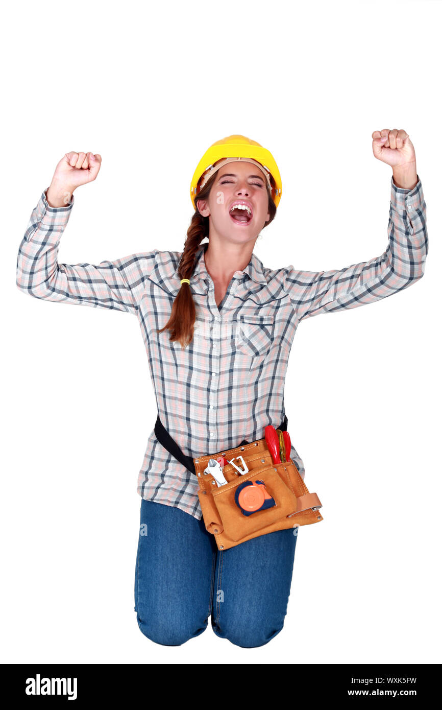 Cheering construction worker Stock Photo - Alamy