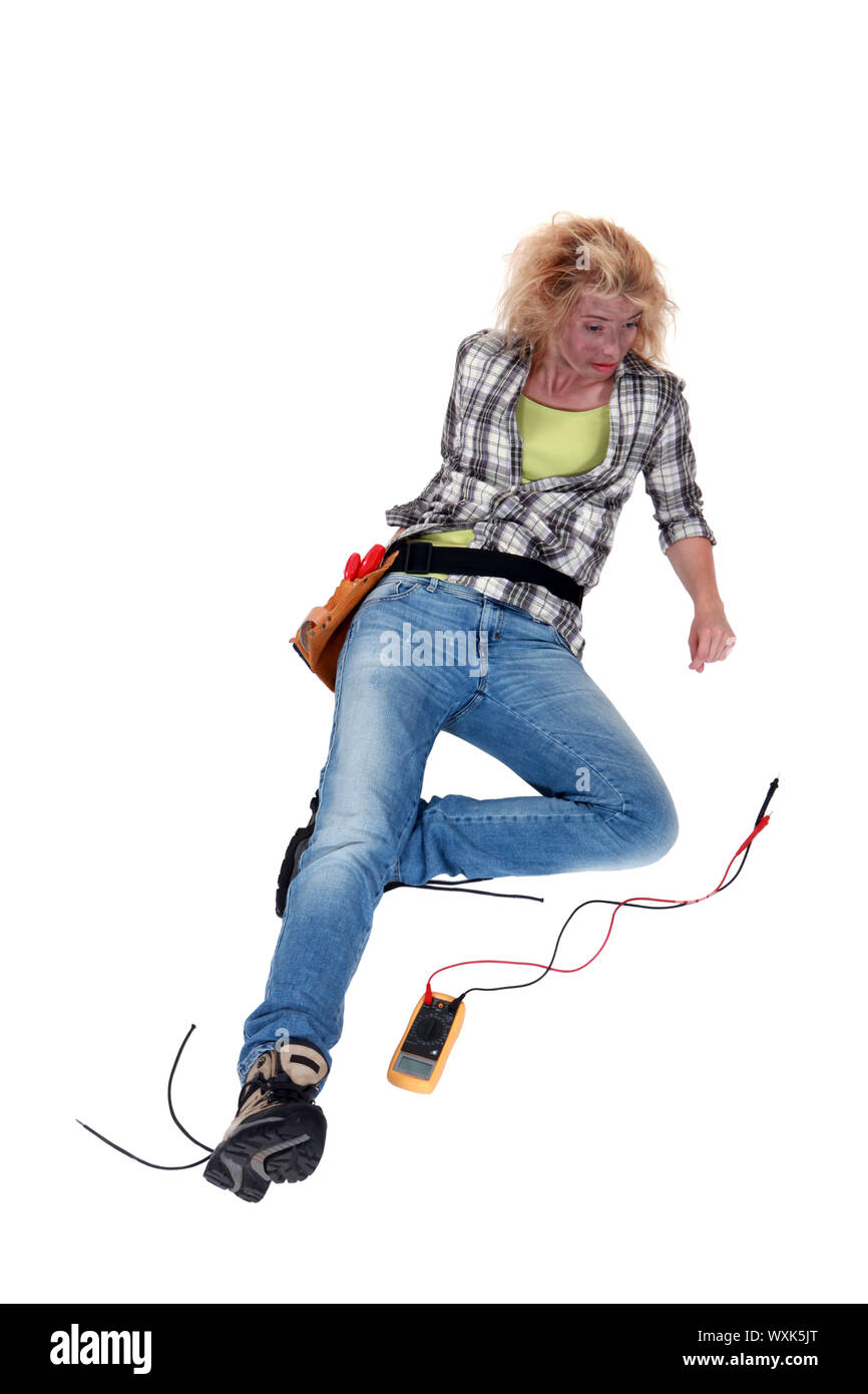 craftswoman lying down after an electric shock Stock Photo - Alamy