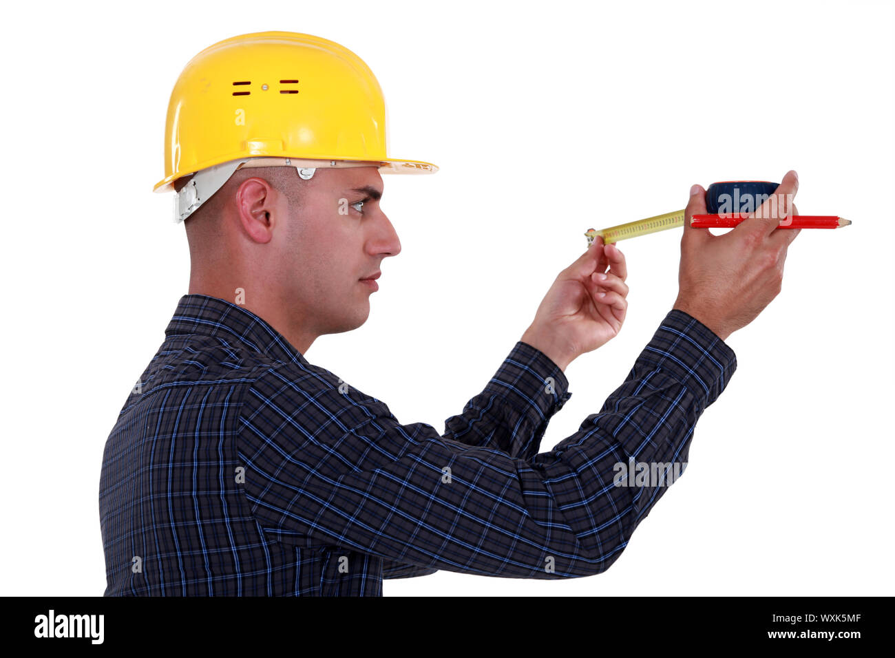 Man watching his measuring tape Stock Photo - Alamy
