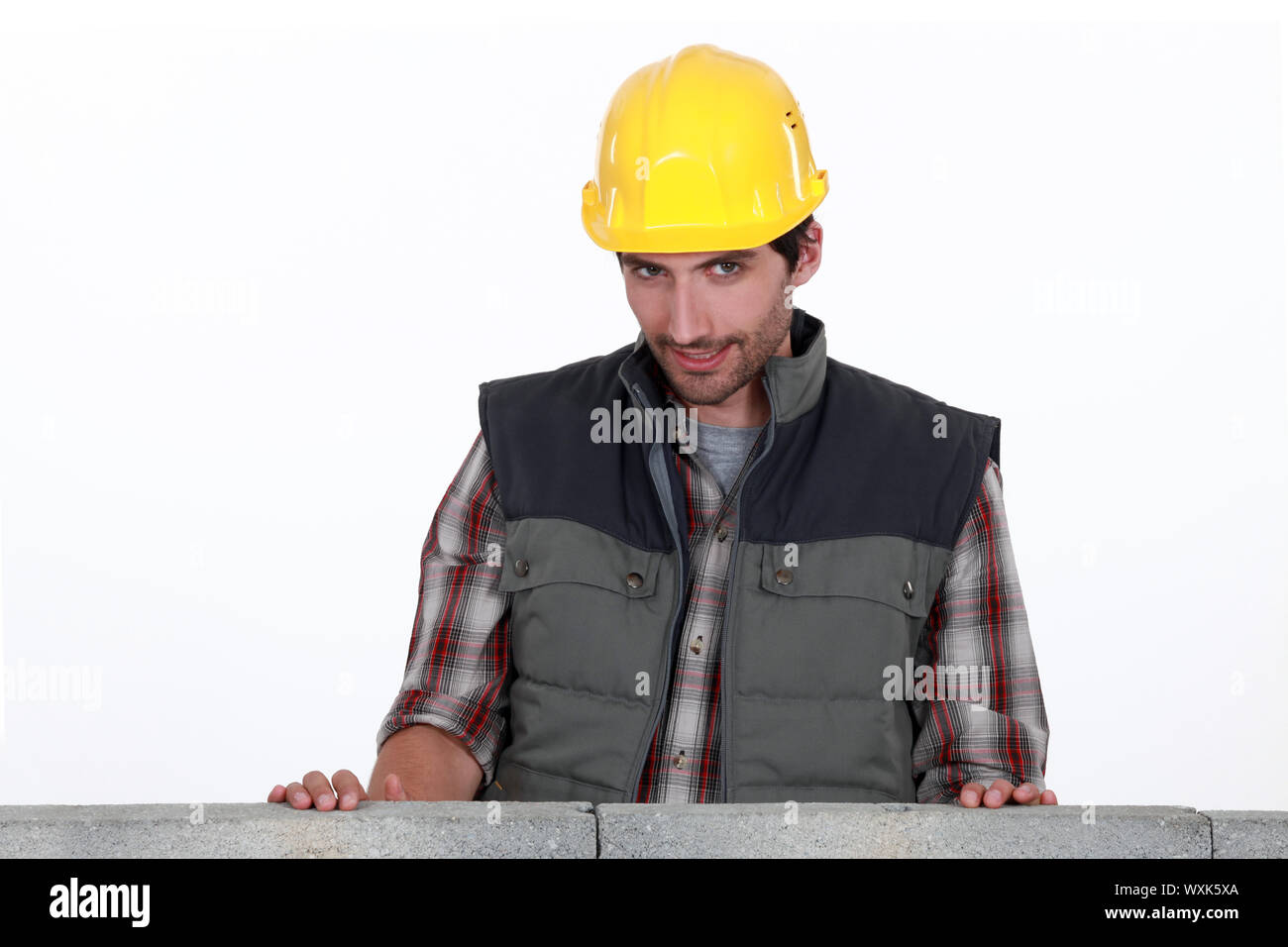 Shy worker behind wall Stock Photo - Alamy