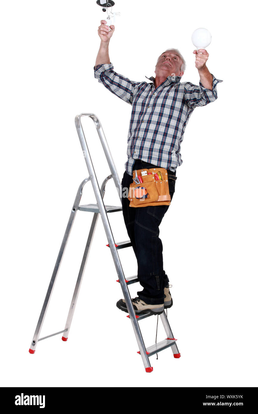 Electrocuted man changing a light bulb Stock Photo - Alamy