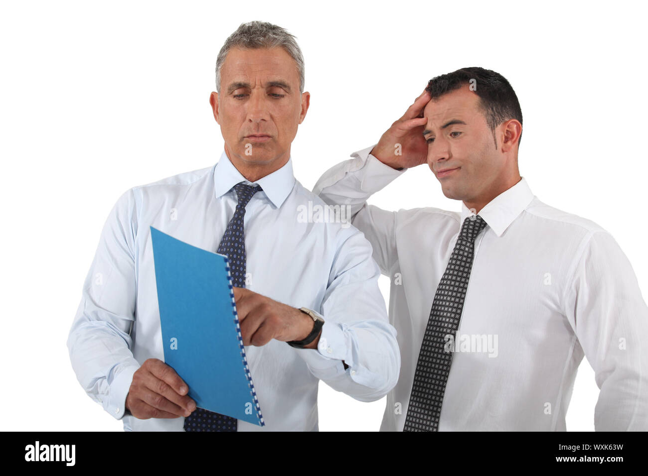 Boss explaining mistake to employee Stock Photo - Alamy