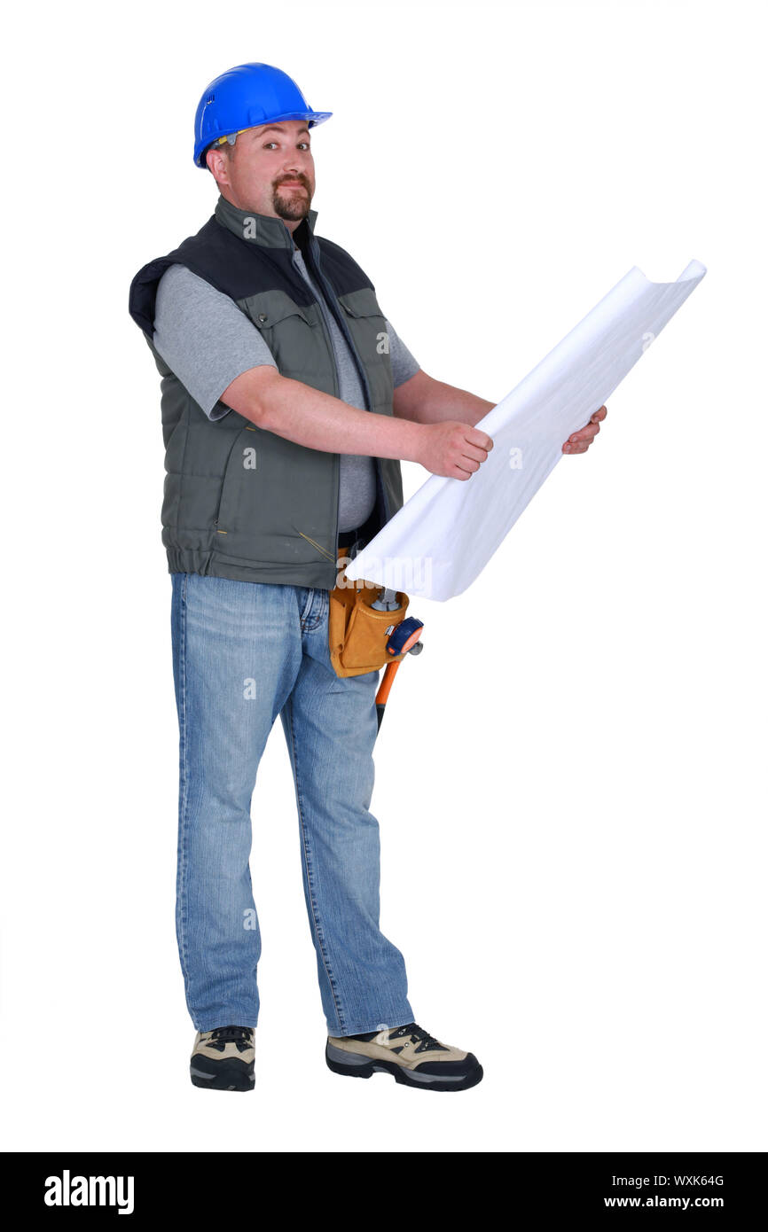 Builder looking at plans Stock Photo - Alamy
