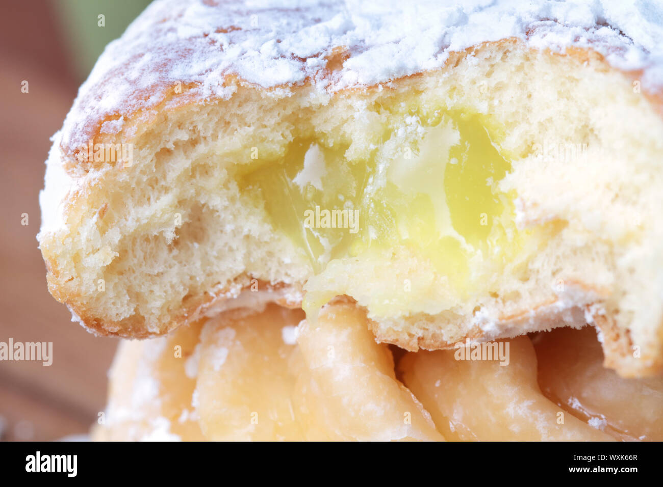 Lemon filled jelly donut stacked on another donut. Shallow DOF Stock ...