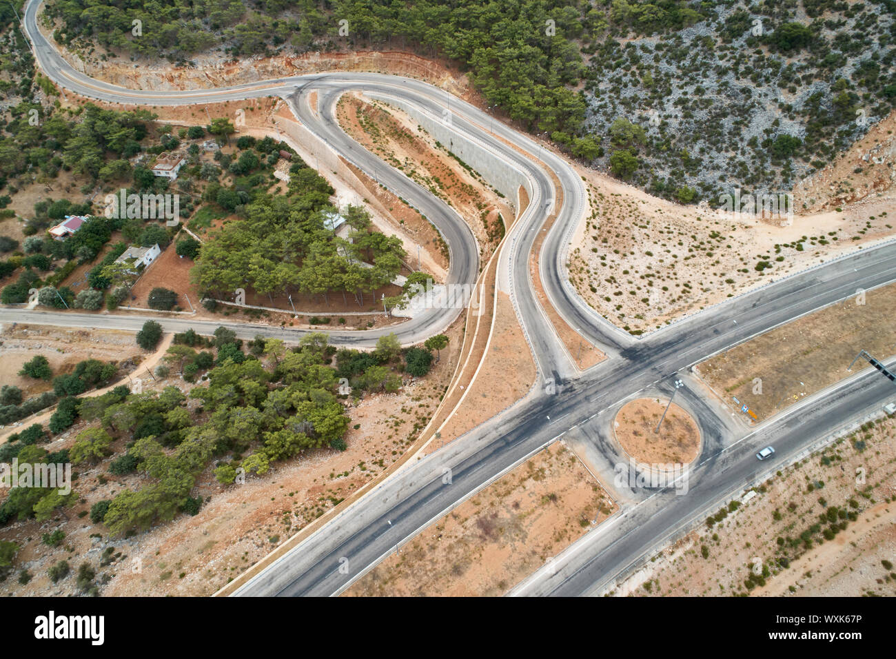 Highway interchange with roundabout, hairpin bends and retaining walls ...