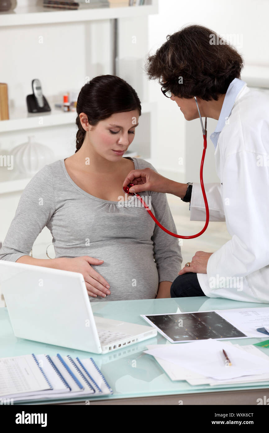 Pregnant woman at a doctor's surgery Stock Photo - Alamy