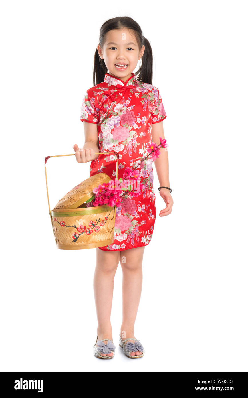 Full length China girl in traditional Chinese cheongsam dress holding a ...