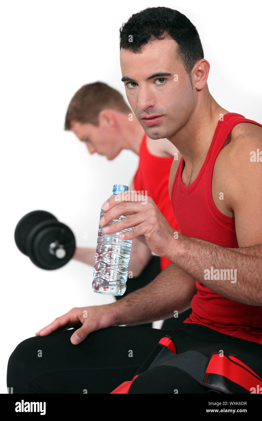 Two men working out at the gym Stock Photo - Alamy