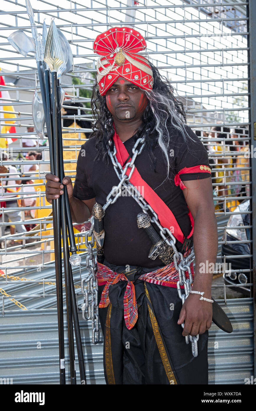 A devout Hindu man dressed as the deity Sangani Dee Baba at the ...