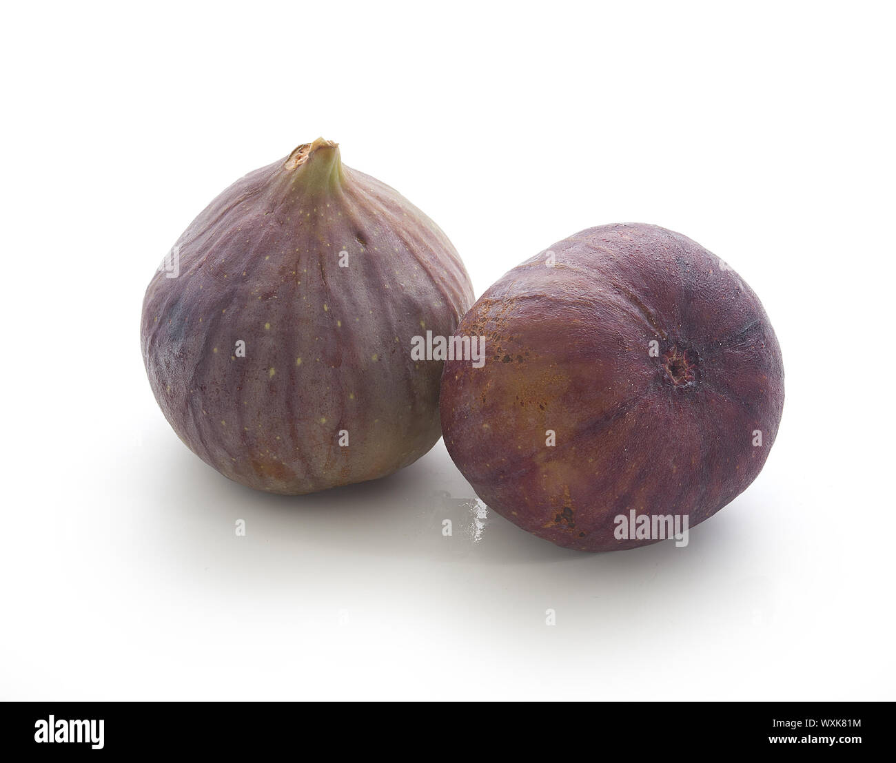 Two fresh fig fruit on the white background Stock Photo - Alamy