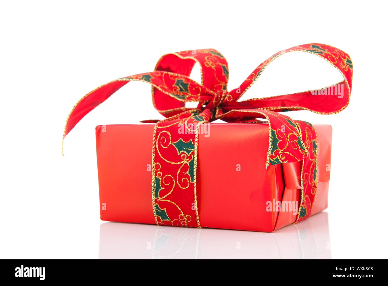 Luxury red Christmas present with golden ribbon isolated white ...