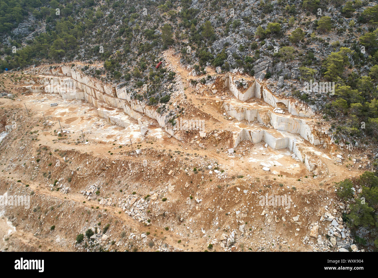 Marble quarry ledges. Terraces of cutted stone material. Aerial view ...