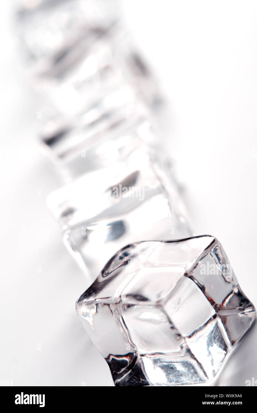 stack of ice cubes on white background Stock Photo - Alamy