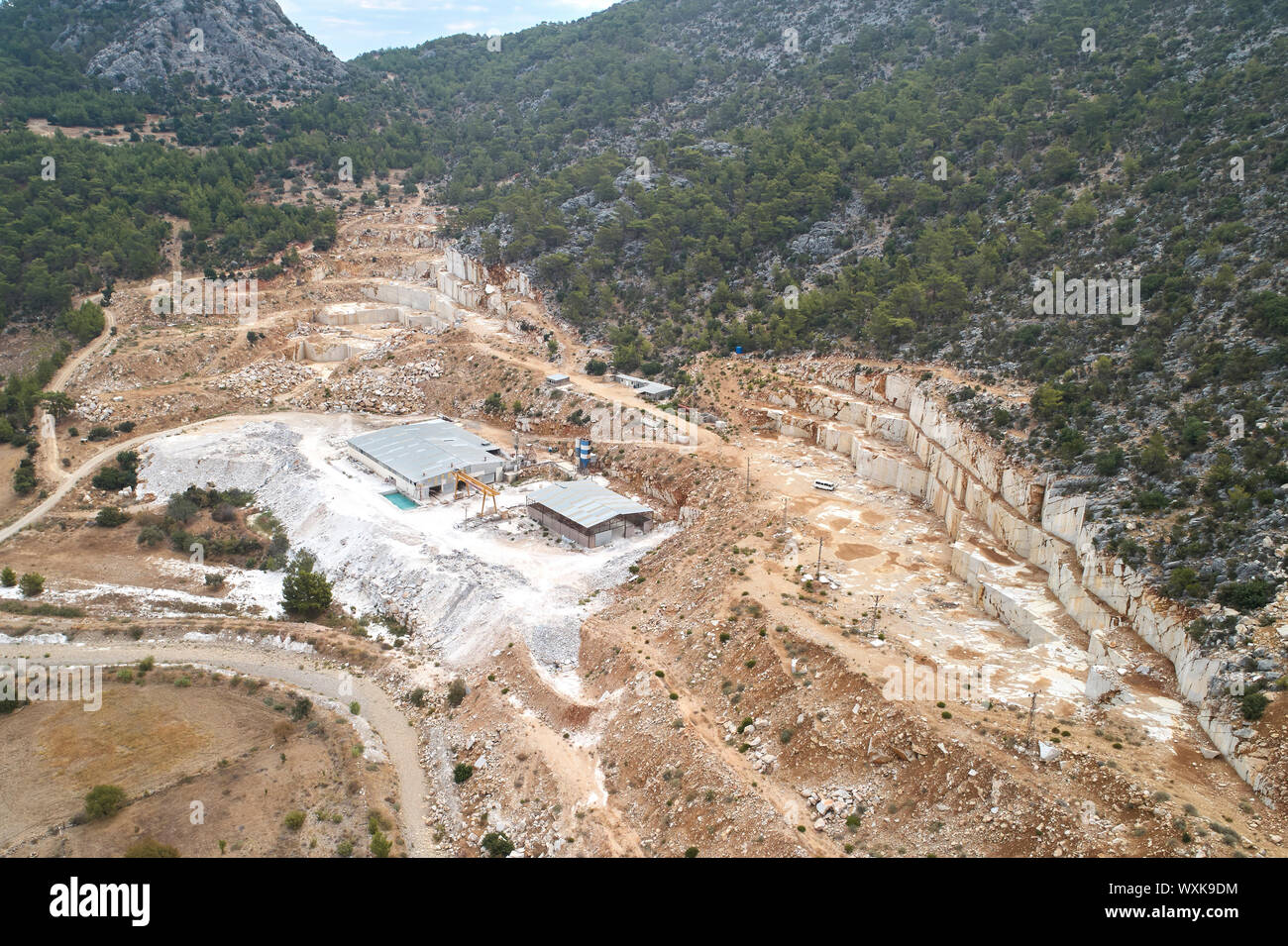 Marble quarry ledges. Terraces of cutted stone material. Aerial view ...