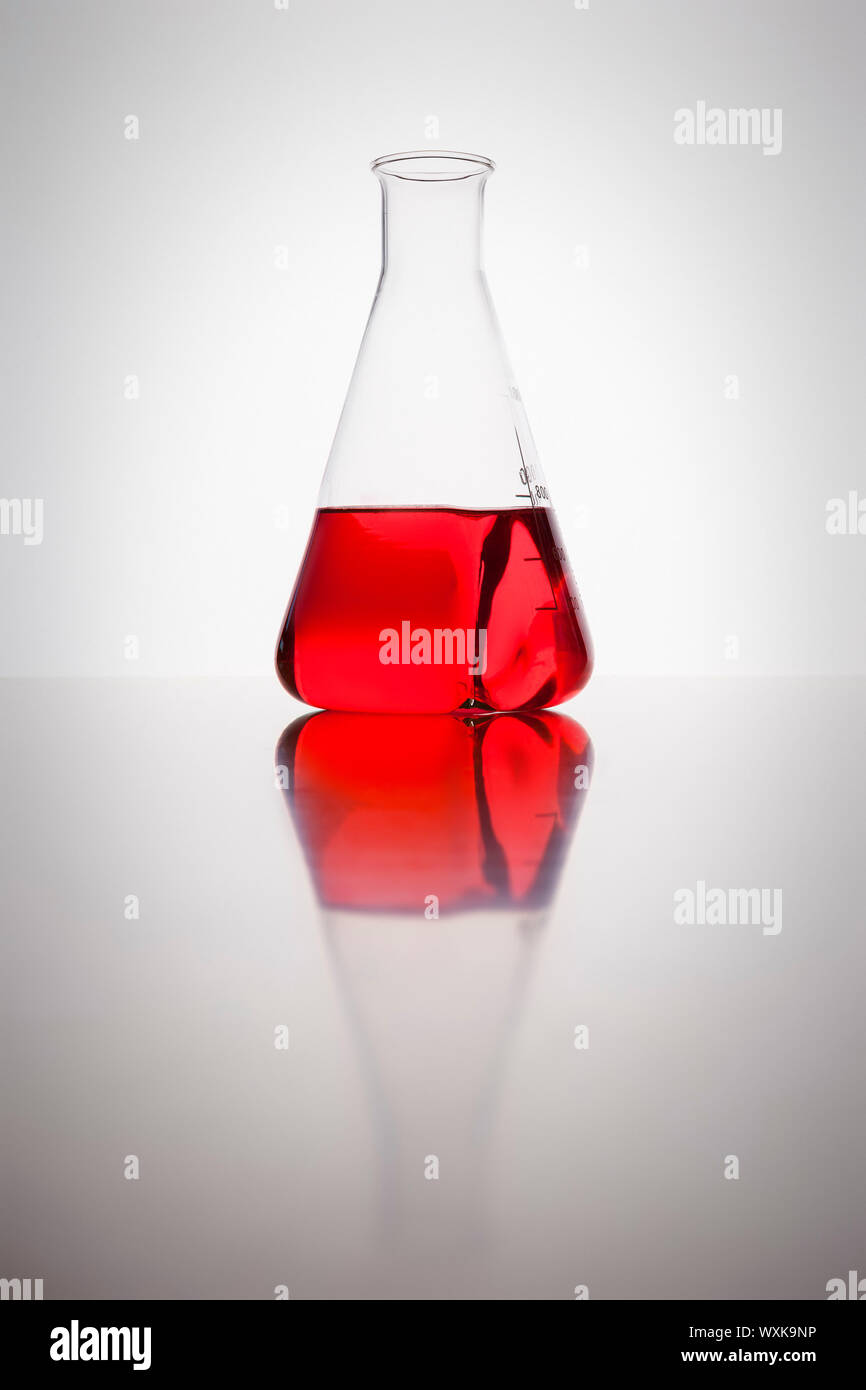 A glass bottle with red liquid in a laboratory Stock Photo - Alamy