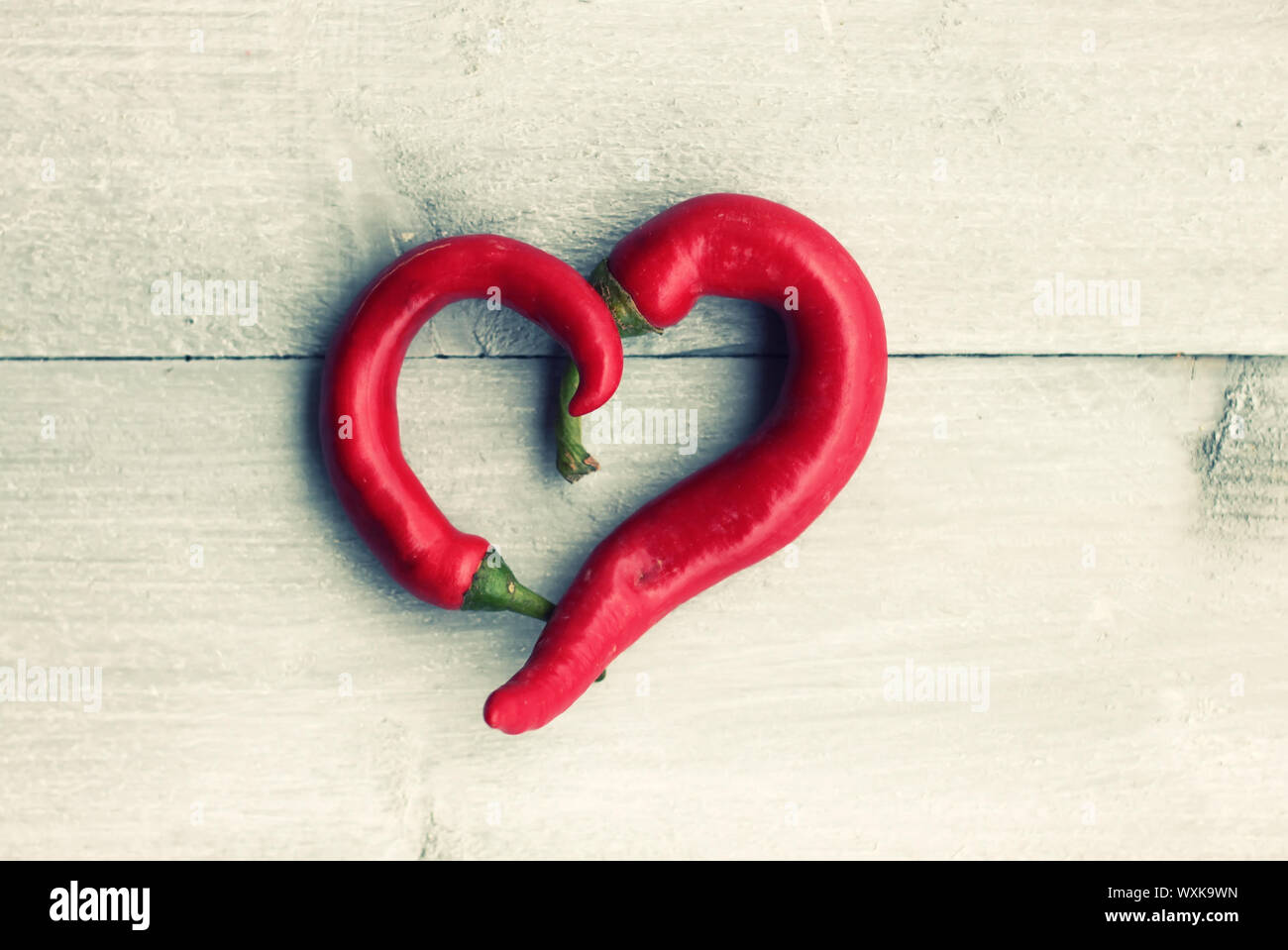 Photo of red heart shape chili pepper Stock Photo - Alamy